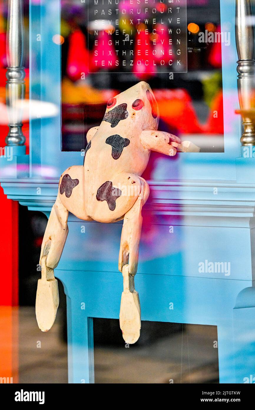 articulated wooden frog toy in window display Stock Photo - Alamy