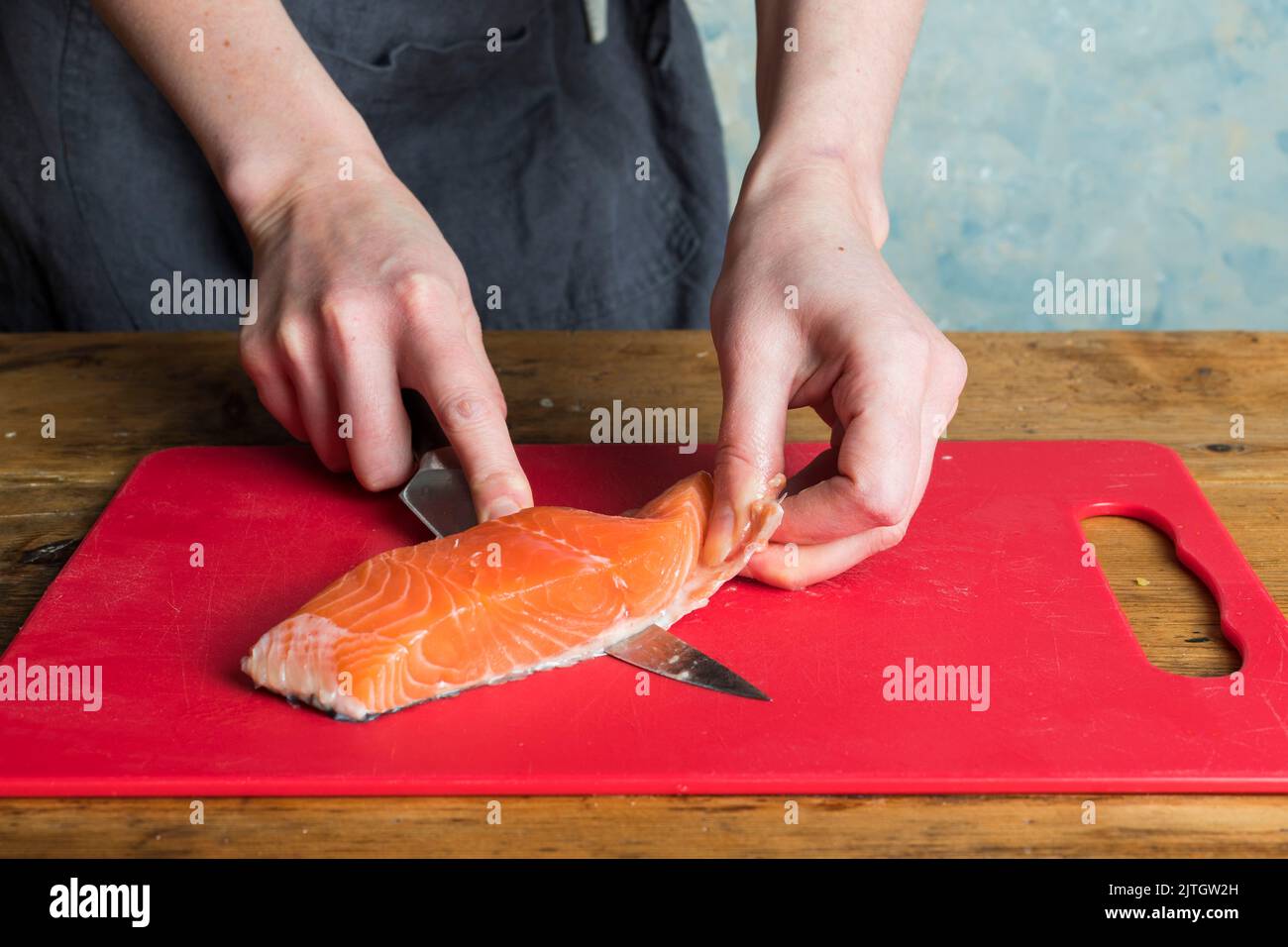 How to skin a fillet of fish Stock Photo - Alamy