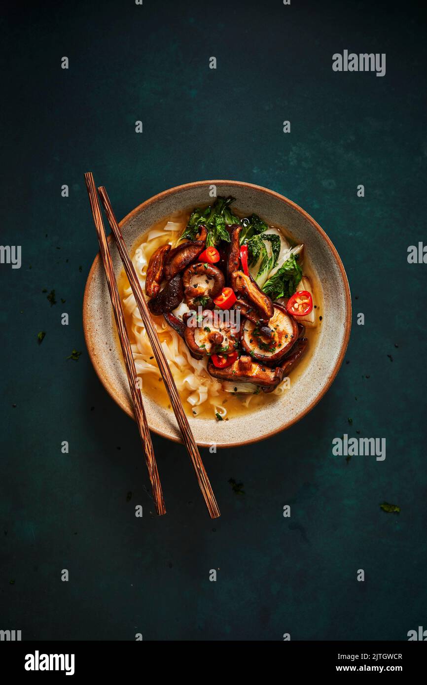 Mushroom Pak Choi Chilli Noodles with Chopsticks Stock Photo - Alamy
