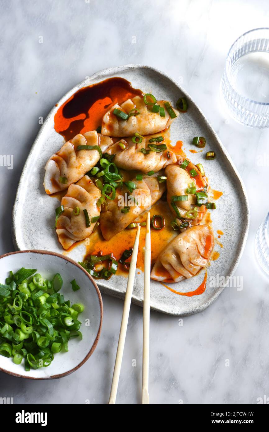 Pleated Dumplings in Chilli oil and Black Rice Vinegar Topped With ...