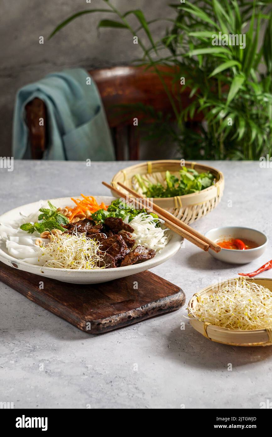 traditional Vietnamese noodle salad - Bun Bo Nam Bo, with beef, rice ...