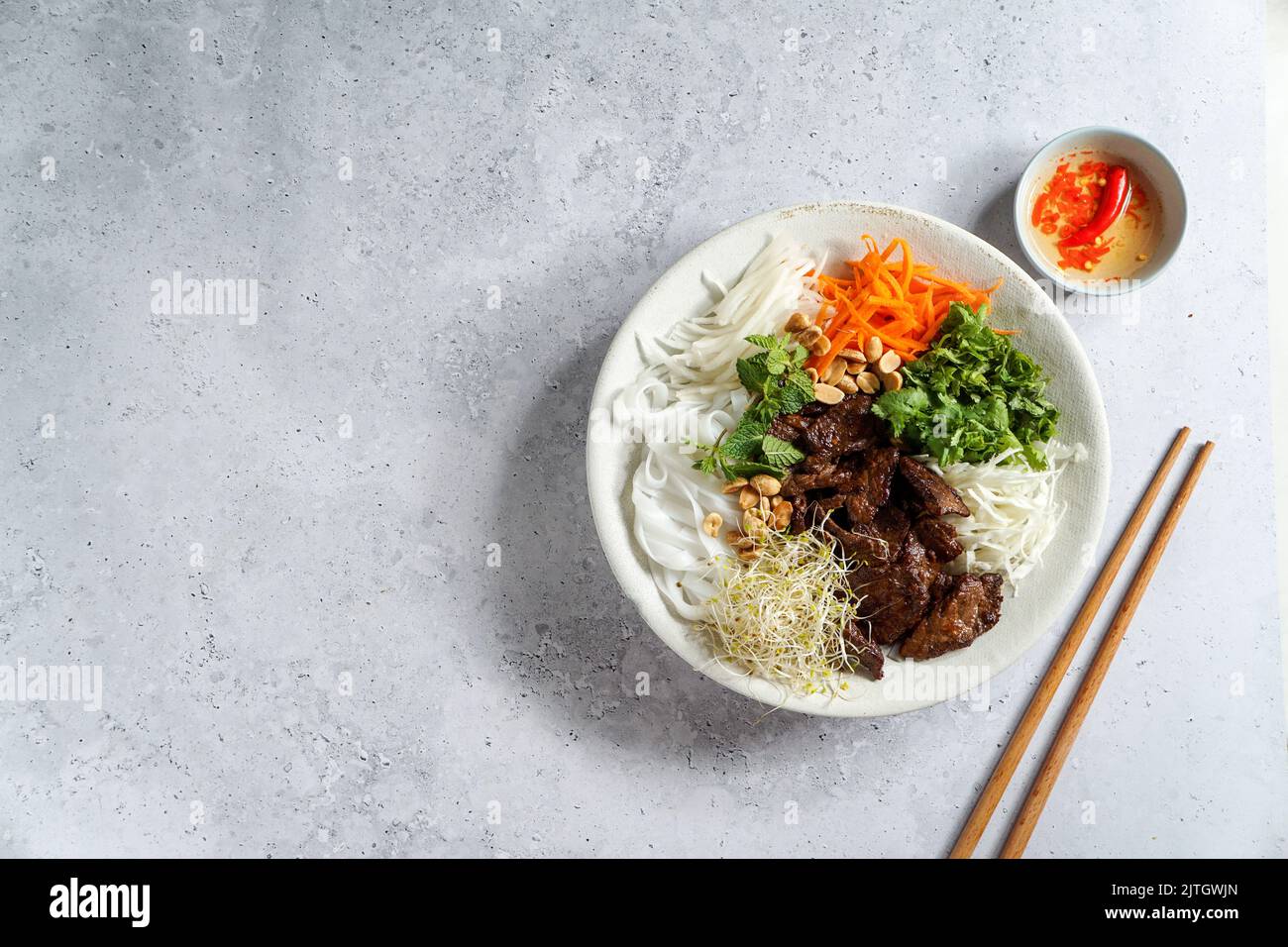 traditional Vietnamese noodle salad - Bun Bo Nam Bo, with beef, rice ...