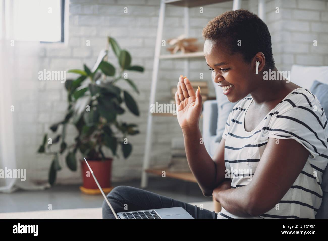 Woman saying hello at home hi-res stock photography and images - Alamy