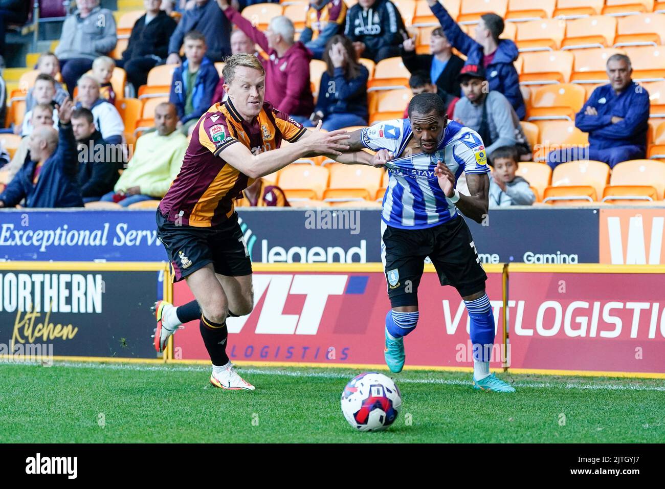 Luke Hendrie #17 of Bradford City holds back Jaden Brown #3 of ...
