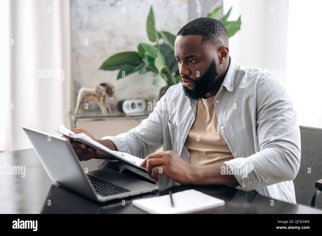 Concentrated clever african american busy business man, company ceo ...
