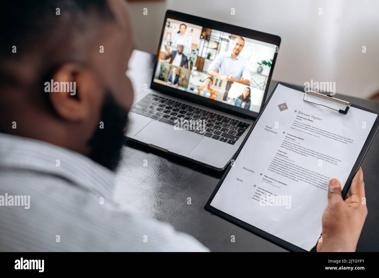 Job interview, African American company hiring manager, sits at office ...