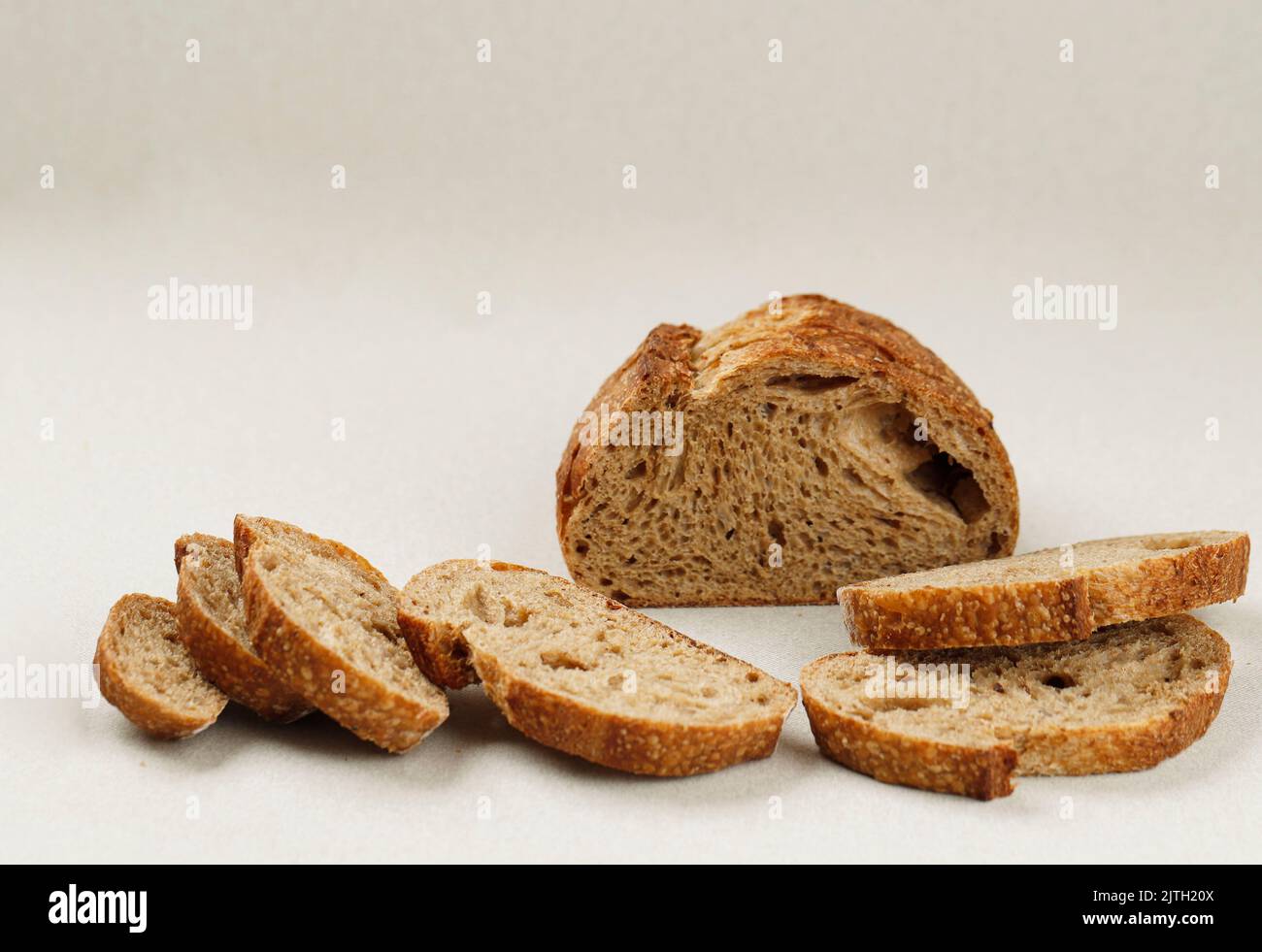 Bread, Traditional Sourdough Bread Cut into Slices on a Cream Light ...