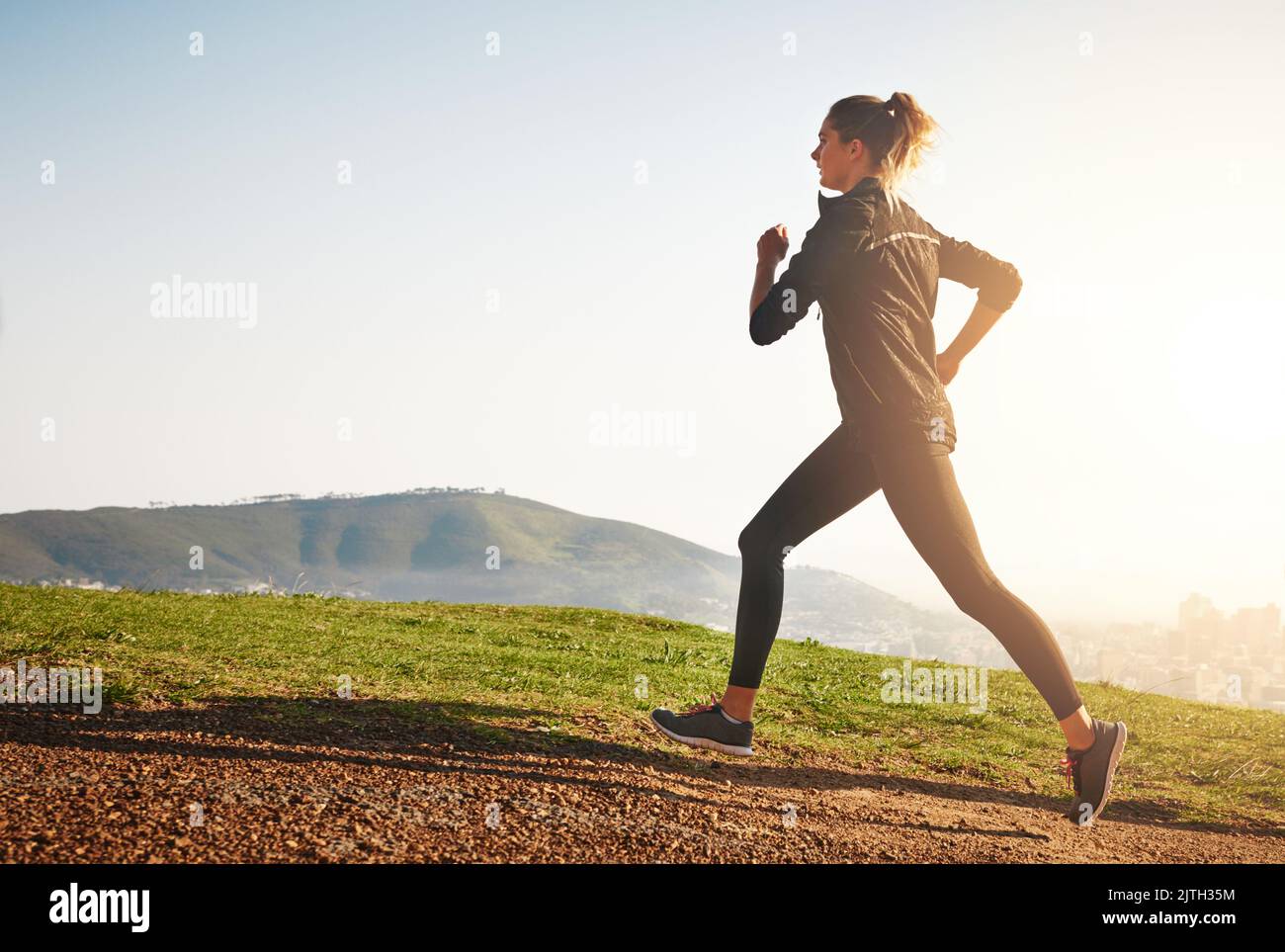 Female runner training outdoors fitness hi-res stock photography and ...