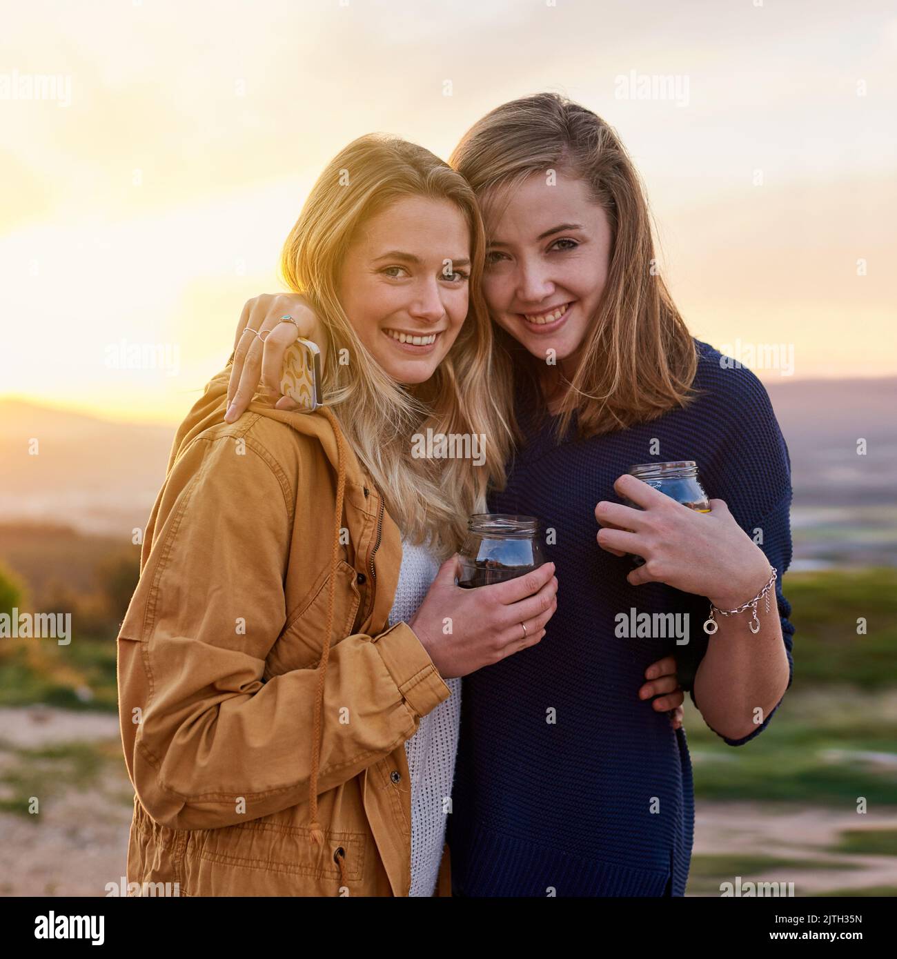 Were sisters at heart. Portrait of two friends posing while enjoying a ...