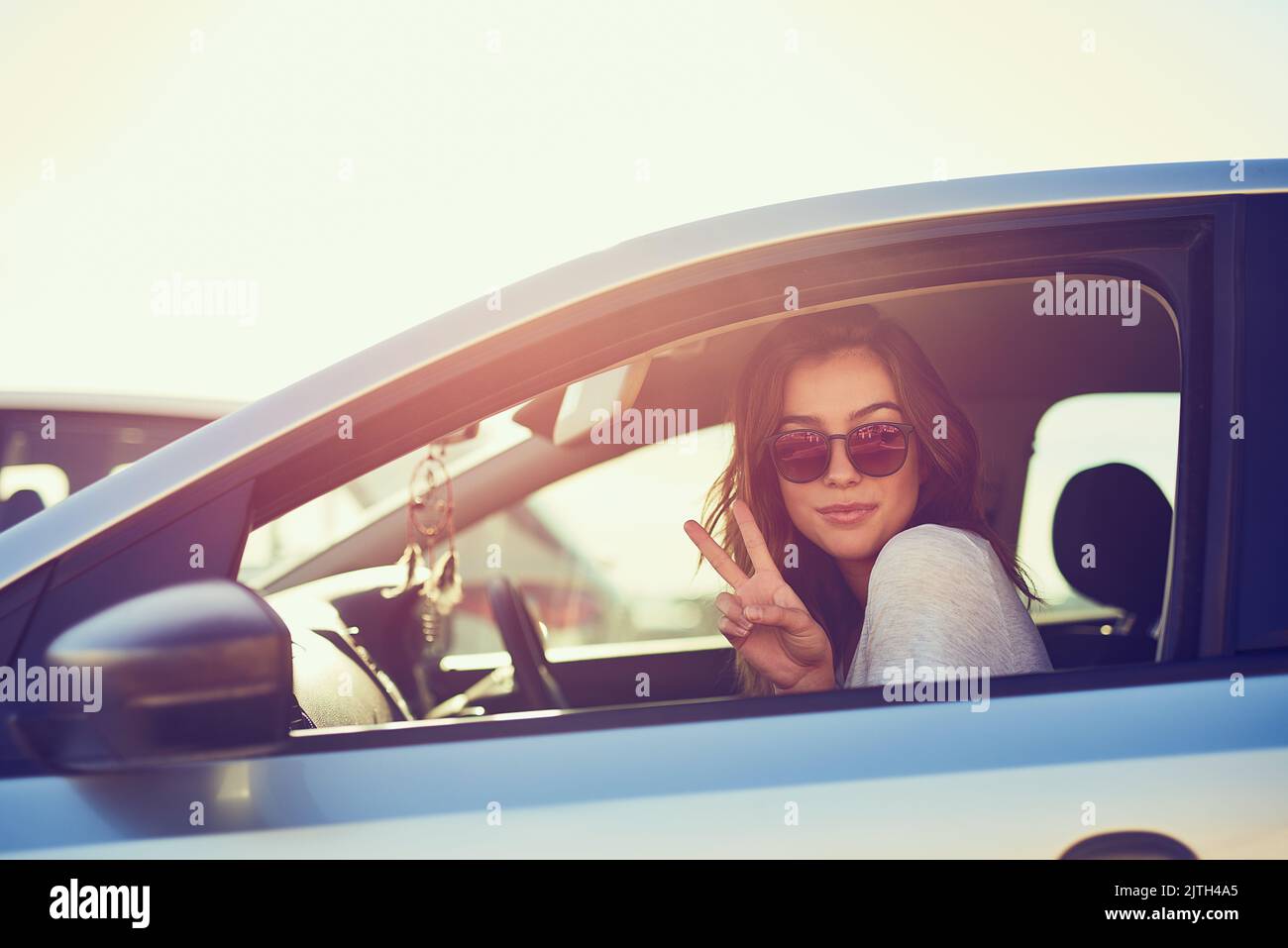 Its all about finding peace. Portrait of a young woman giving you the ...