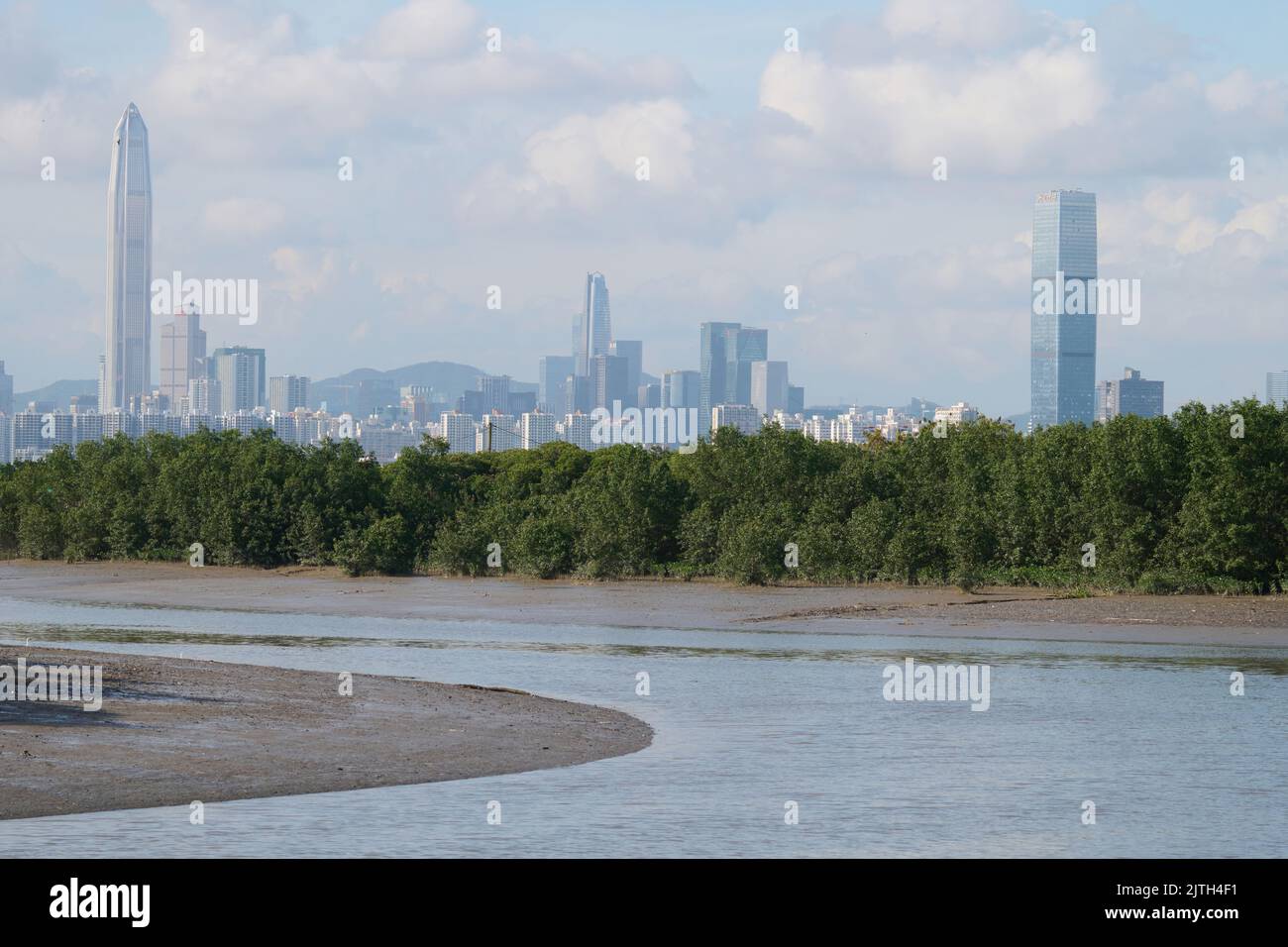 A beautiful view of Shan Pui river surrounded by trees and buildings in ...