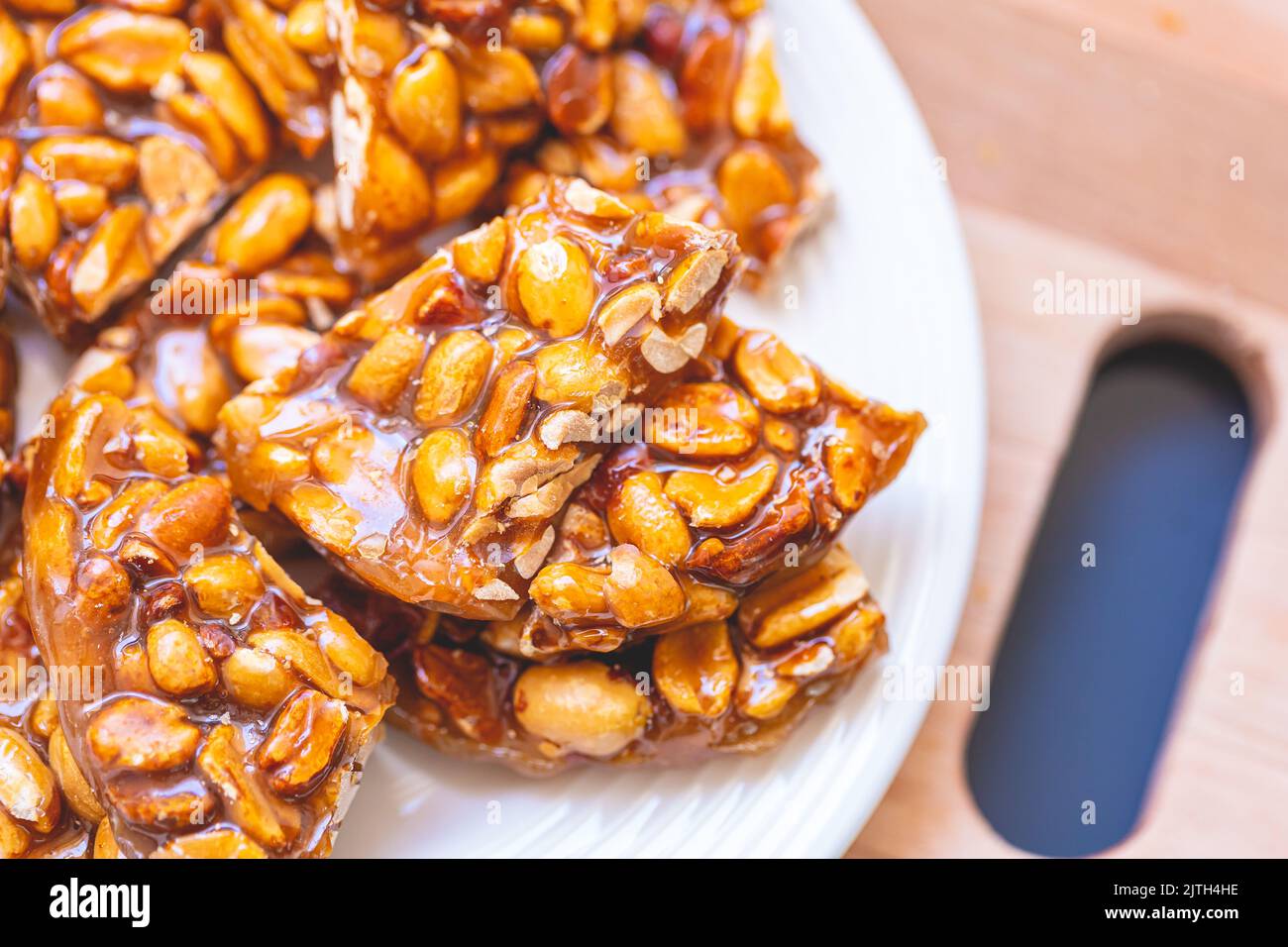 Brazilian peanut-based caramelized sweet that in Brazilian Portuguese ...