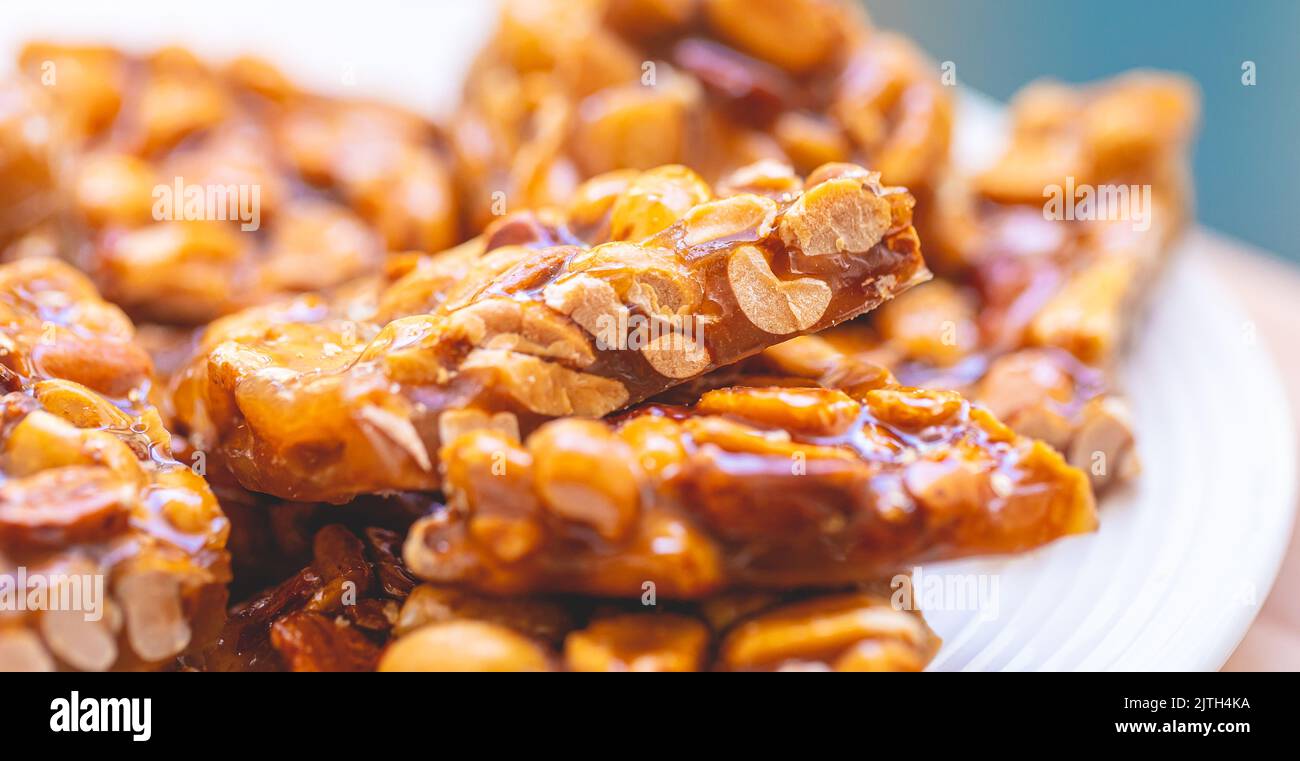 Brazilian peanut-based caramelized sweet that in Brazilian Portuguese ...