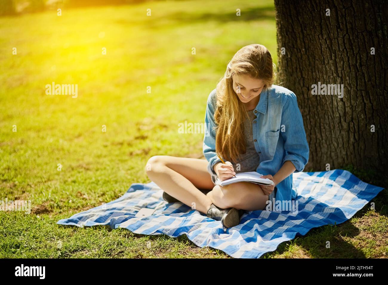 Being in nature inspires creativity. a young student studying ...