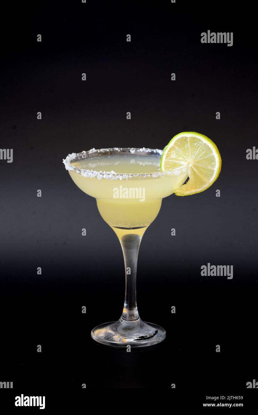 Margarita cocktail, an alcoholic cocktail in a tall glass with a slice ...