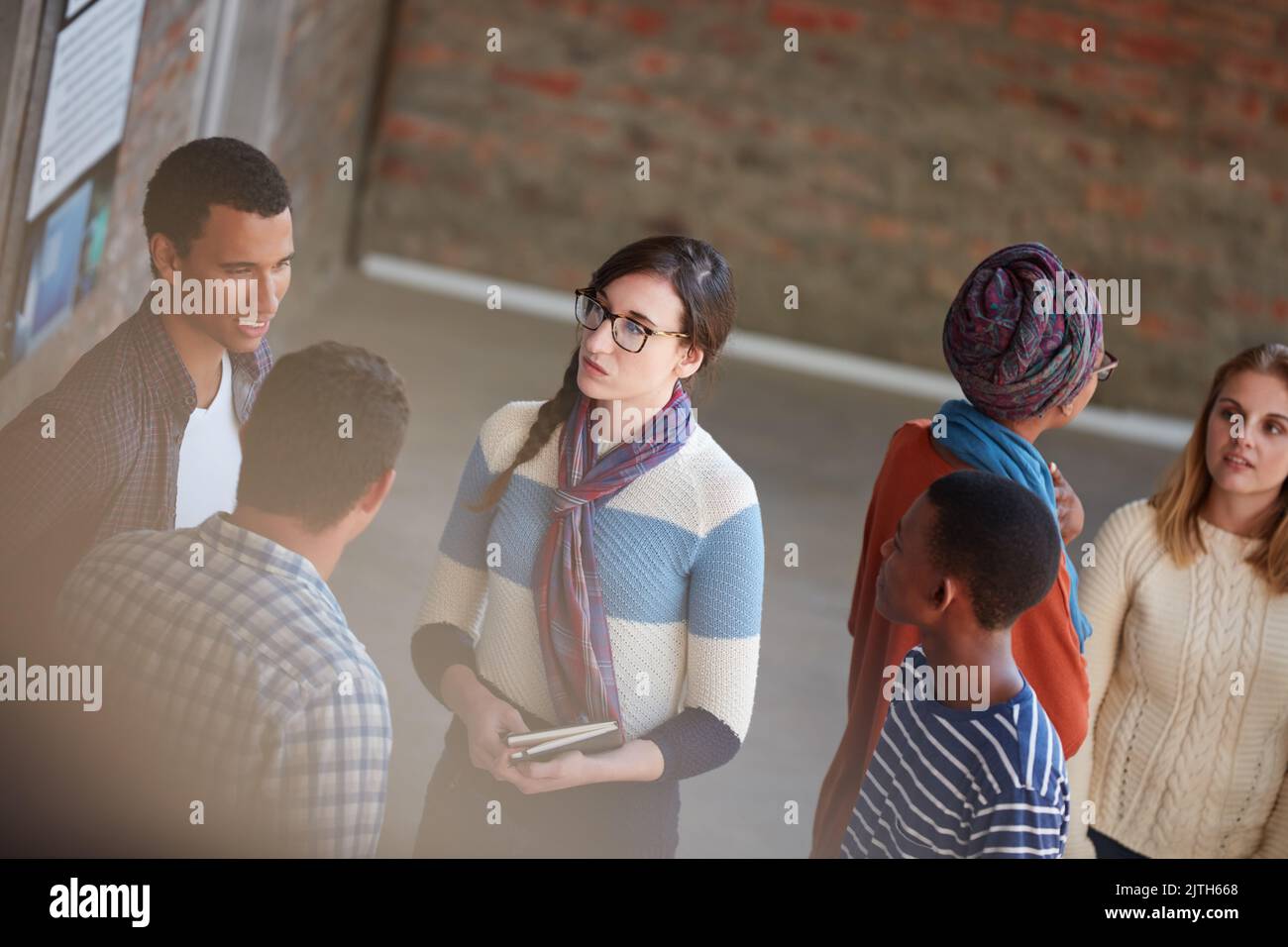 Catching up between their classes. a group of university students ...