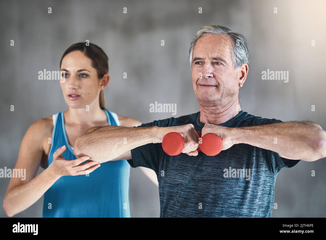 Maintaining muscle mass with regular exercise. a senior man using ...