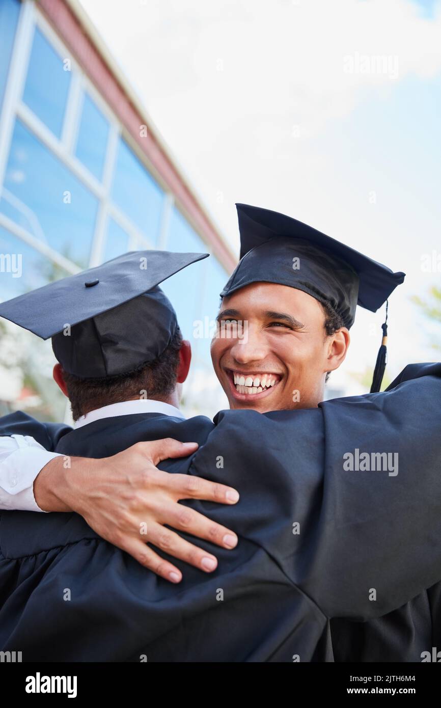 We both made it. two female students congratulating each other on ...