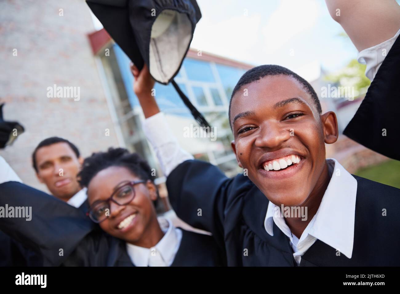 Graduation is reason enough to smile. Portrait of a happy group of ...