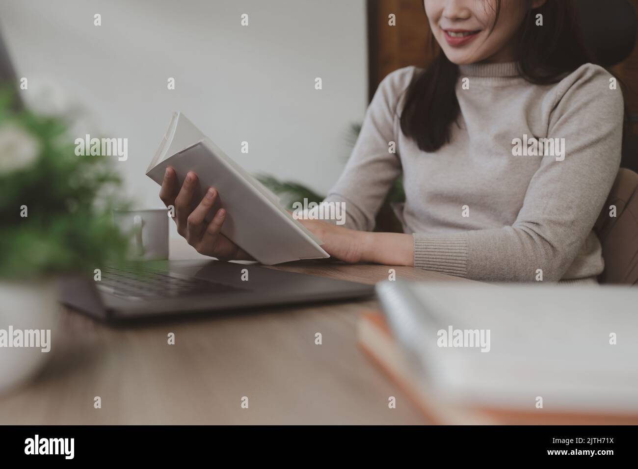 Woman sit desk home read hi-res stock photography and images - Alamy