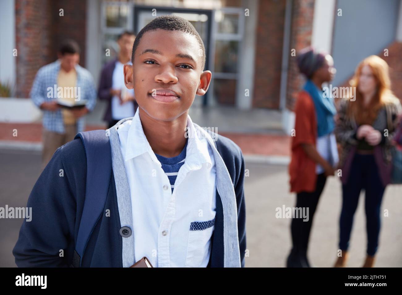 Schools out. Portrait of a happy male student leaving his university ...