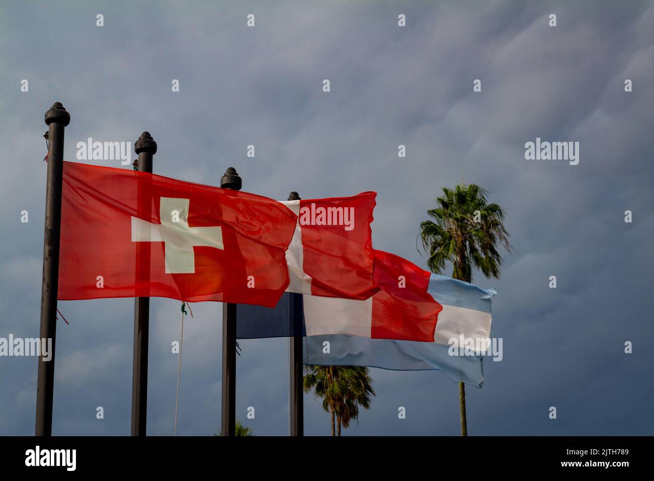 Flags of Switzerland, Italy, France and Argentina flapping in the wind ...