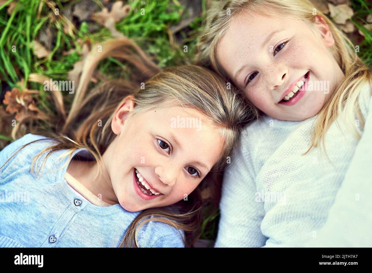 Their sweet smiles could brighten any day. Portrait of two little ...