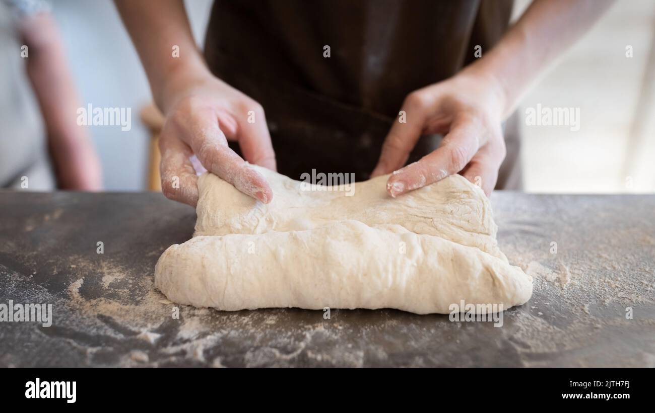 The process of making traditional French baguettes. Forming a blank ...