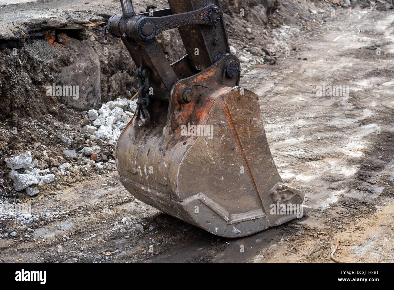 Excavator bucket on the ground in a pit Stock Photo - Alamy