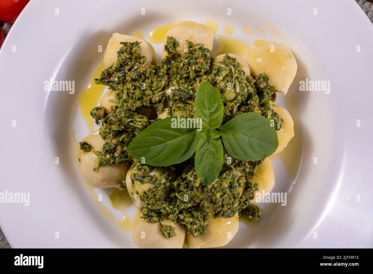 Potato gnocchi with pesto sauce Stock Photo - Alamy