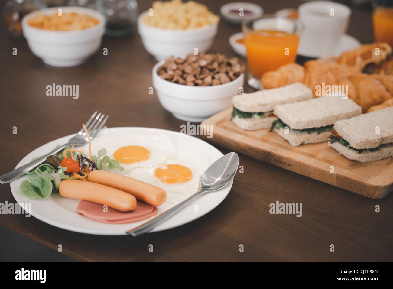 Breakfast served food with beverage coffee, orange juice on table in ...