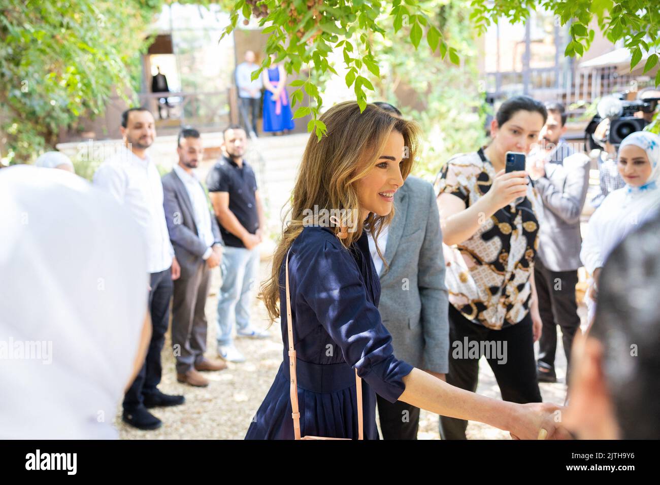 Madaba, Jordan, August 29, 2022. Jordan’s Queen Rania Al Abdullah (center) meets with members of ...
