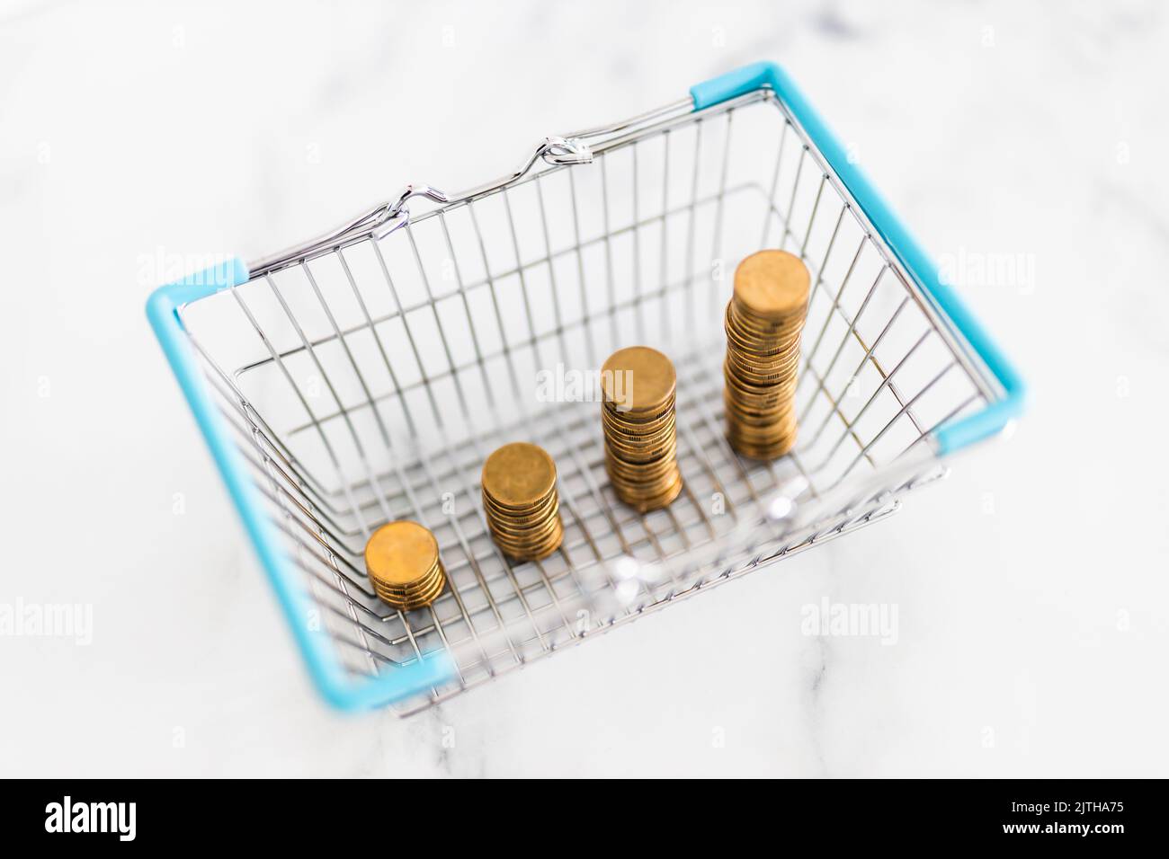 prices going up and rising inflation concept with shopping basket with ...