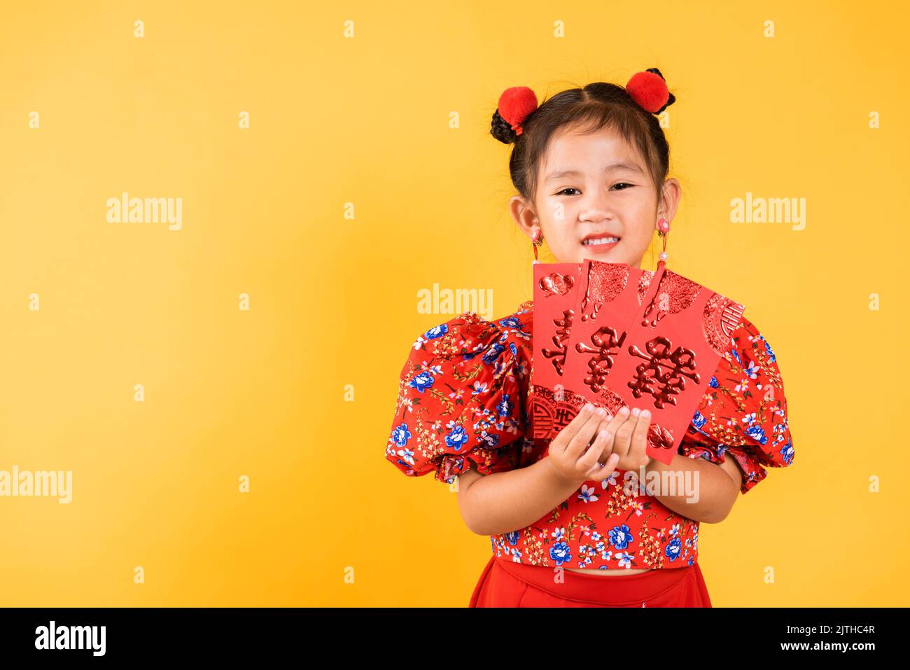 Chinese New Year. Happy Asian Chinese little girl smile wear red ...