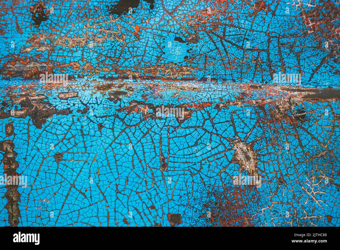 Enamelled colorful cracked and peeling surface of old motorcycle. Rusty ...