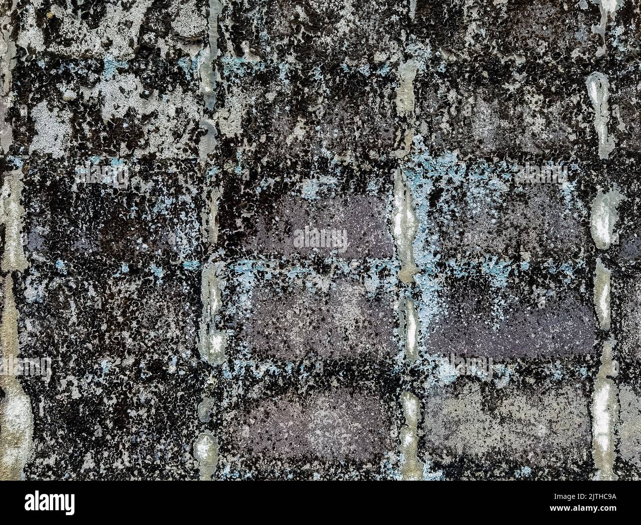 Dirty old eroded cracked plaster cement block fence. Concrete block ...