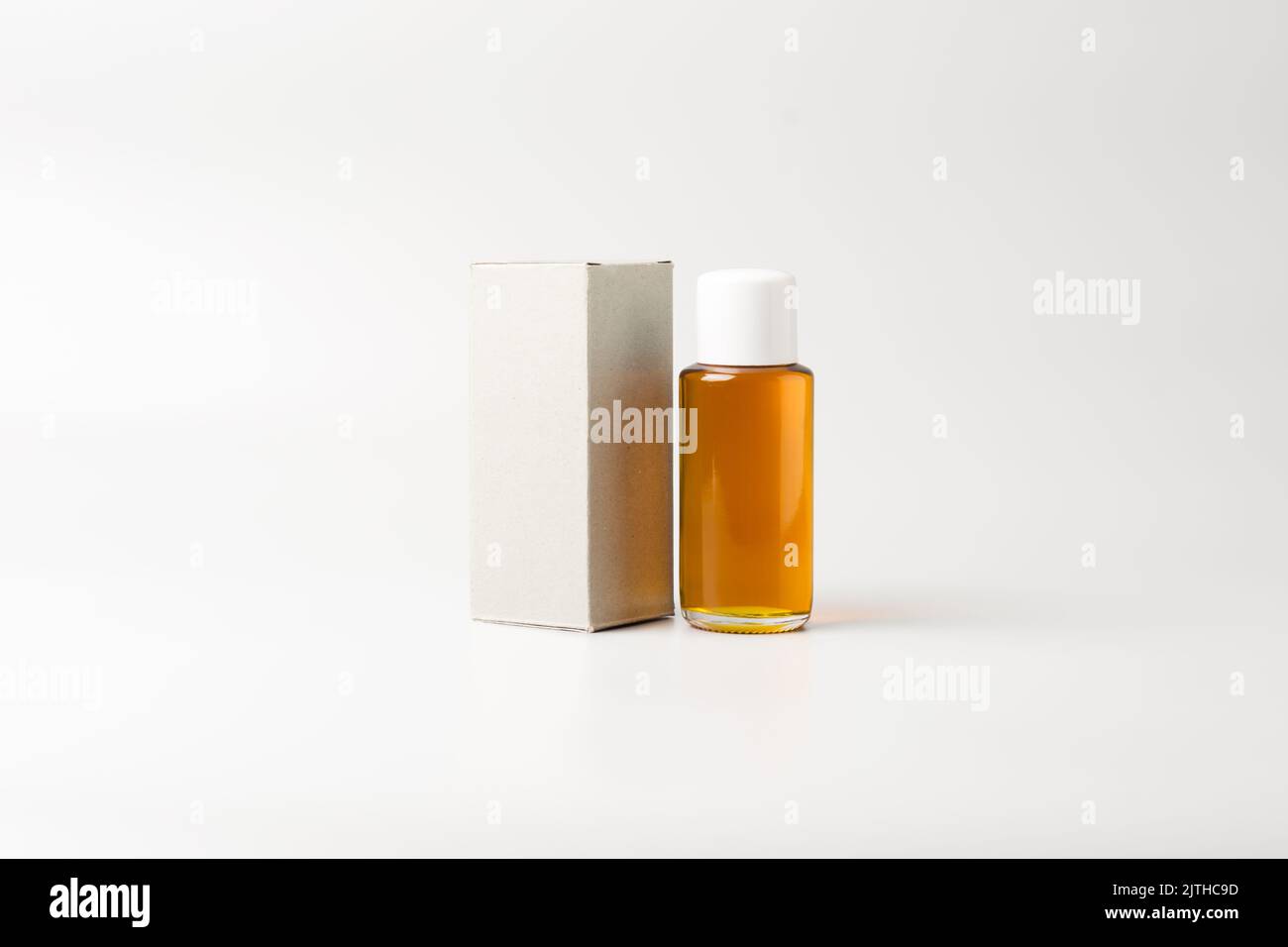small oil bottle with white cap and blank box, mock-up template ...