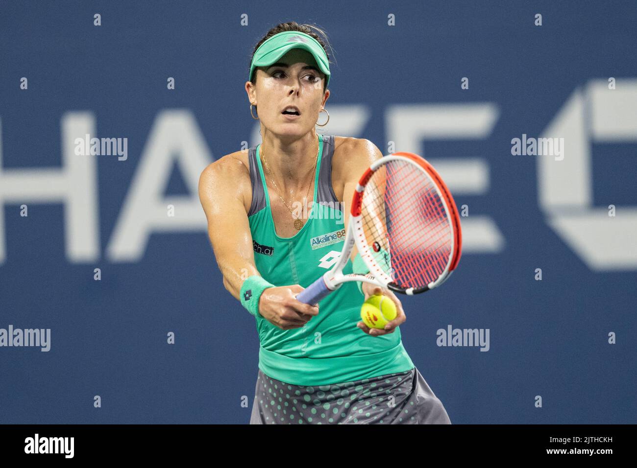 New York, NY - August 30, 2022: Alize Cornet of France serves during US ...