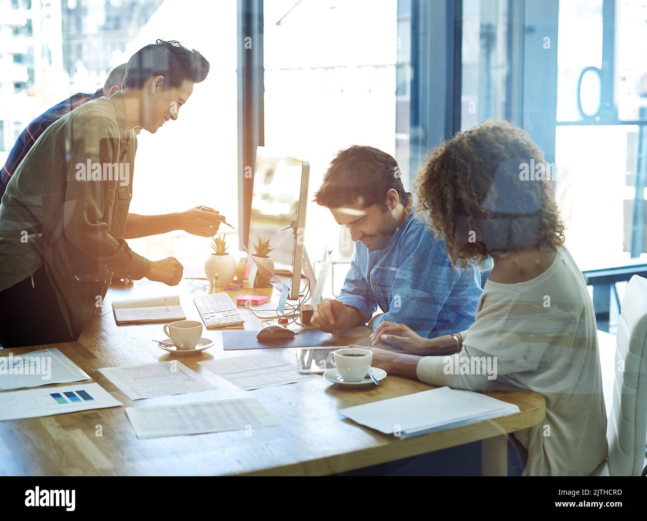 Divided to cover all grounds. businesspeople working in teams in a ...