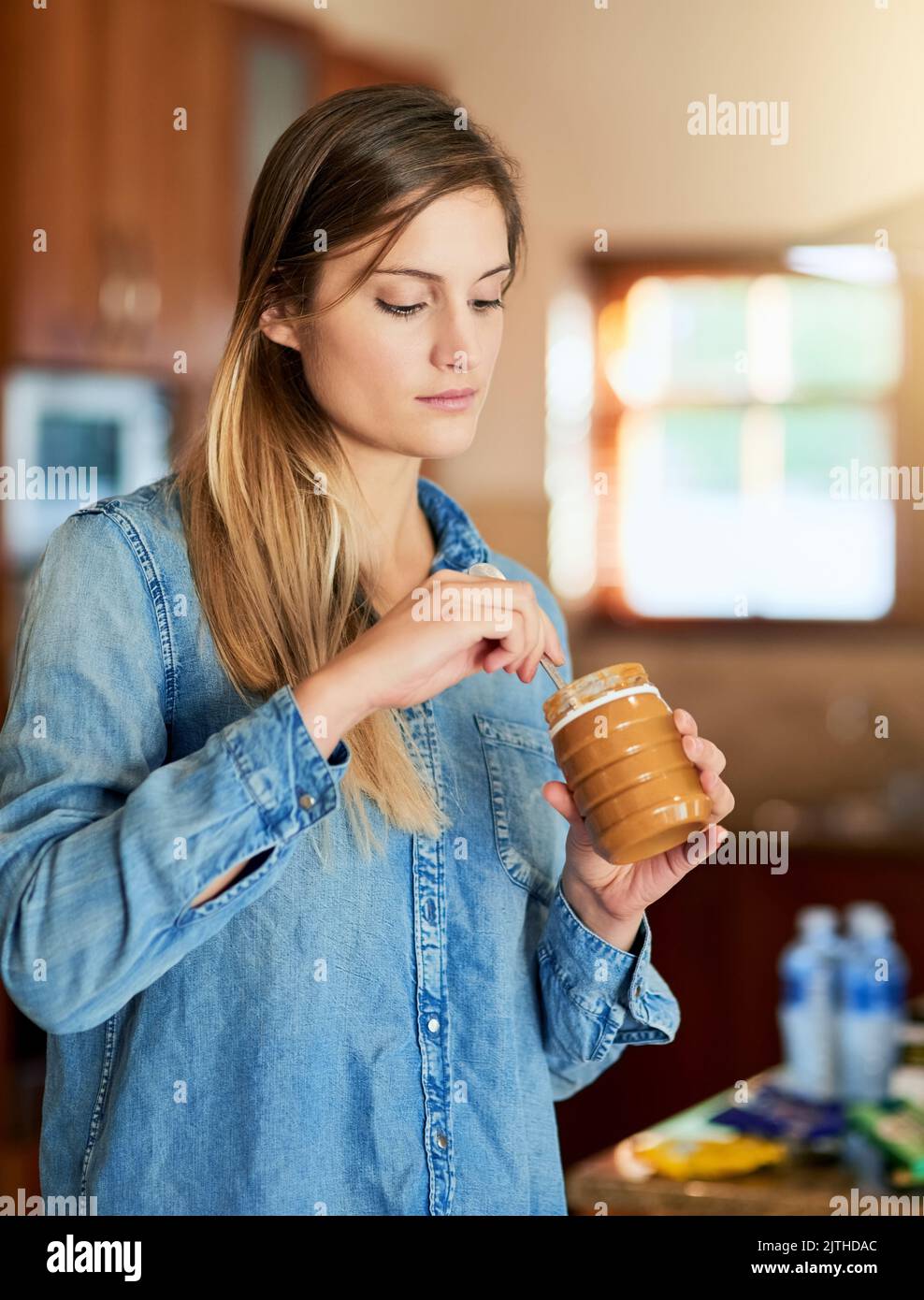 Its about enjoying the sweet things in life. a young woman eating ...