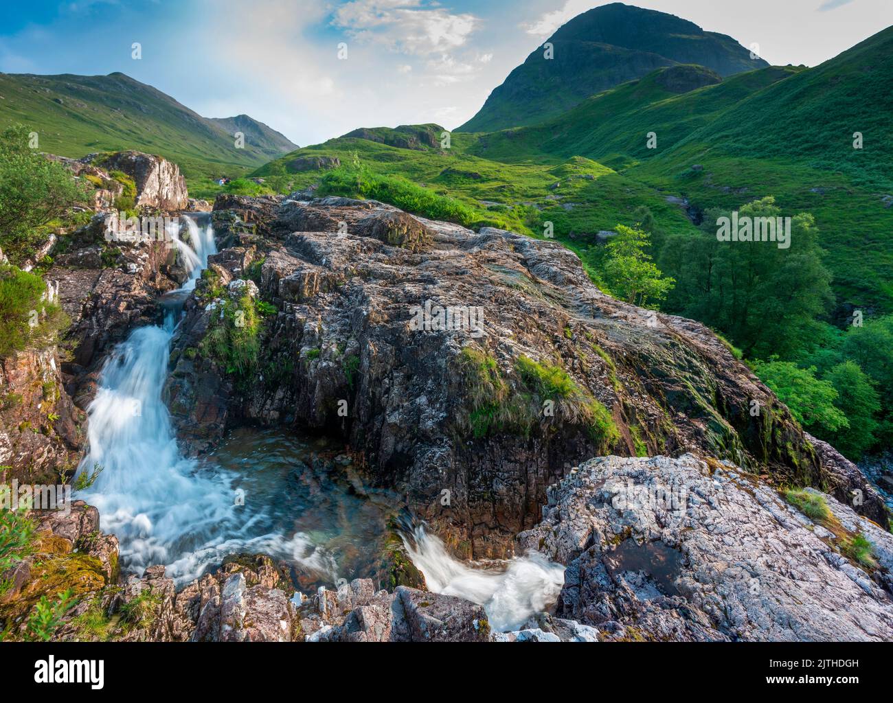On mid summer late afternoon,water from nearby mountains pours down ...