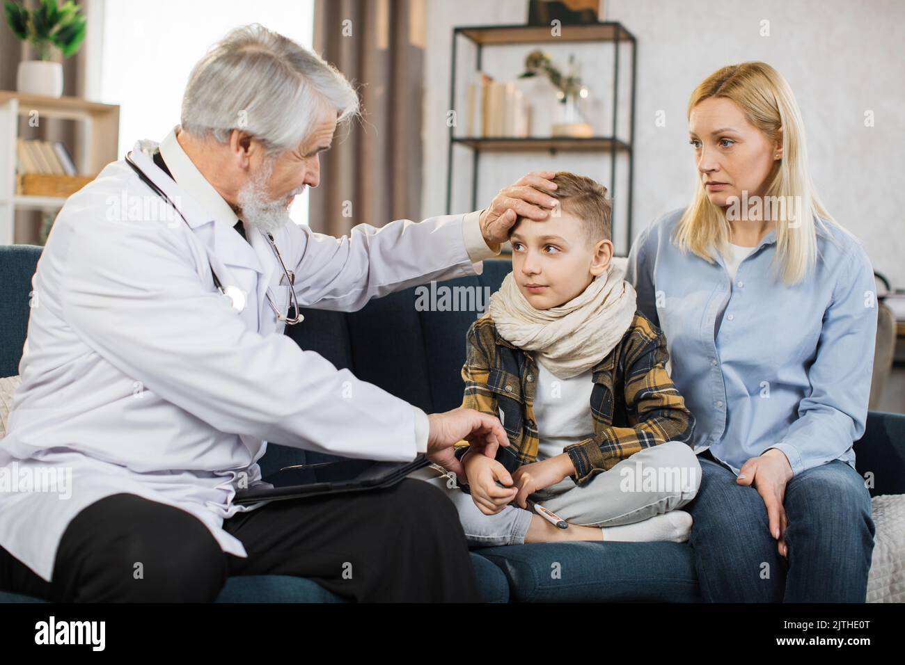 Front view of good-looking professional senior male caucasian doctor in ...