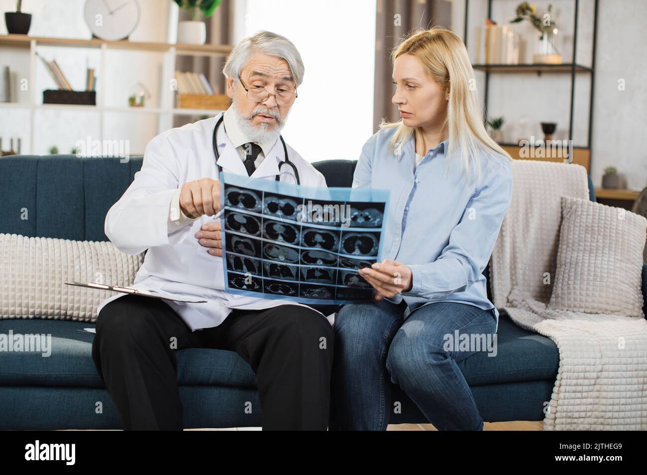 Senior bearded man confident doctor discussing the results of x-ray CT ...
