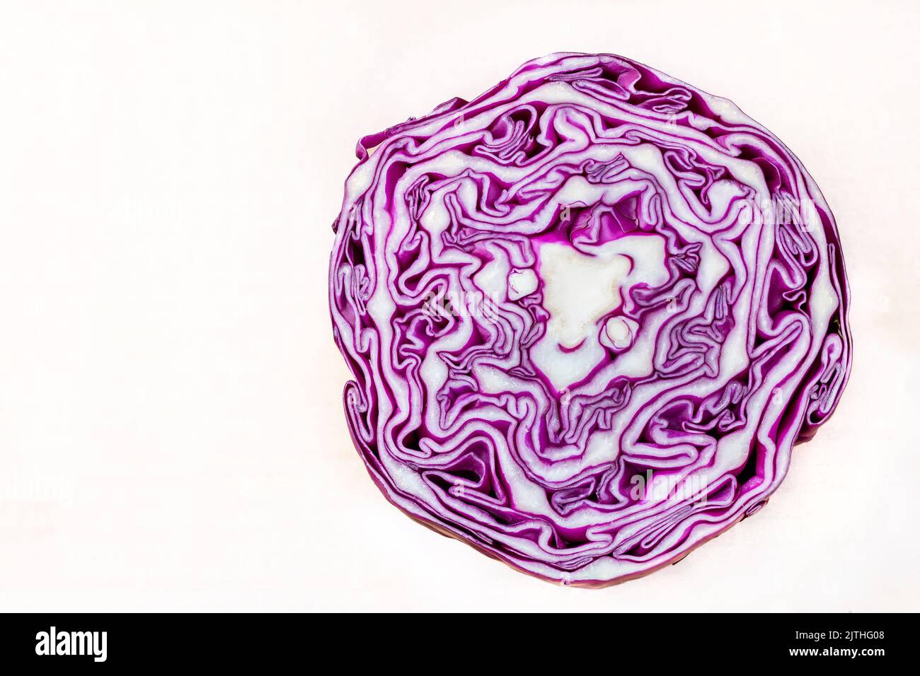 sliced red cabbage from top with copy space. Close up pattern of purple ...