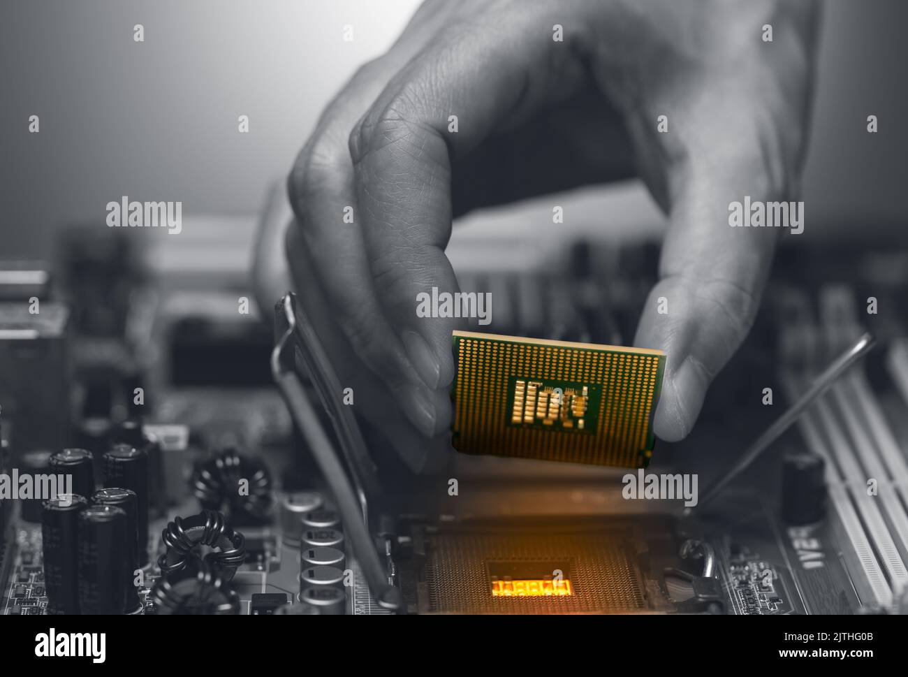 Electronic engineer hand putting computer chip on socket. Chipset on ...