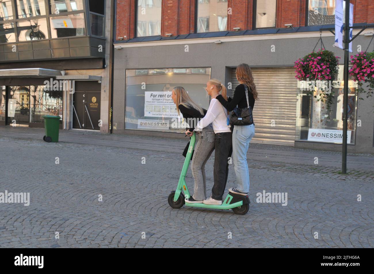 Malmo/Sweden /30 August 2022/ Female electric scooter rider in southern ...