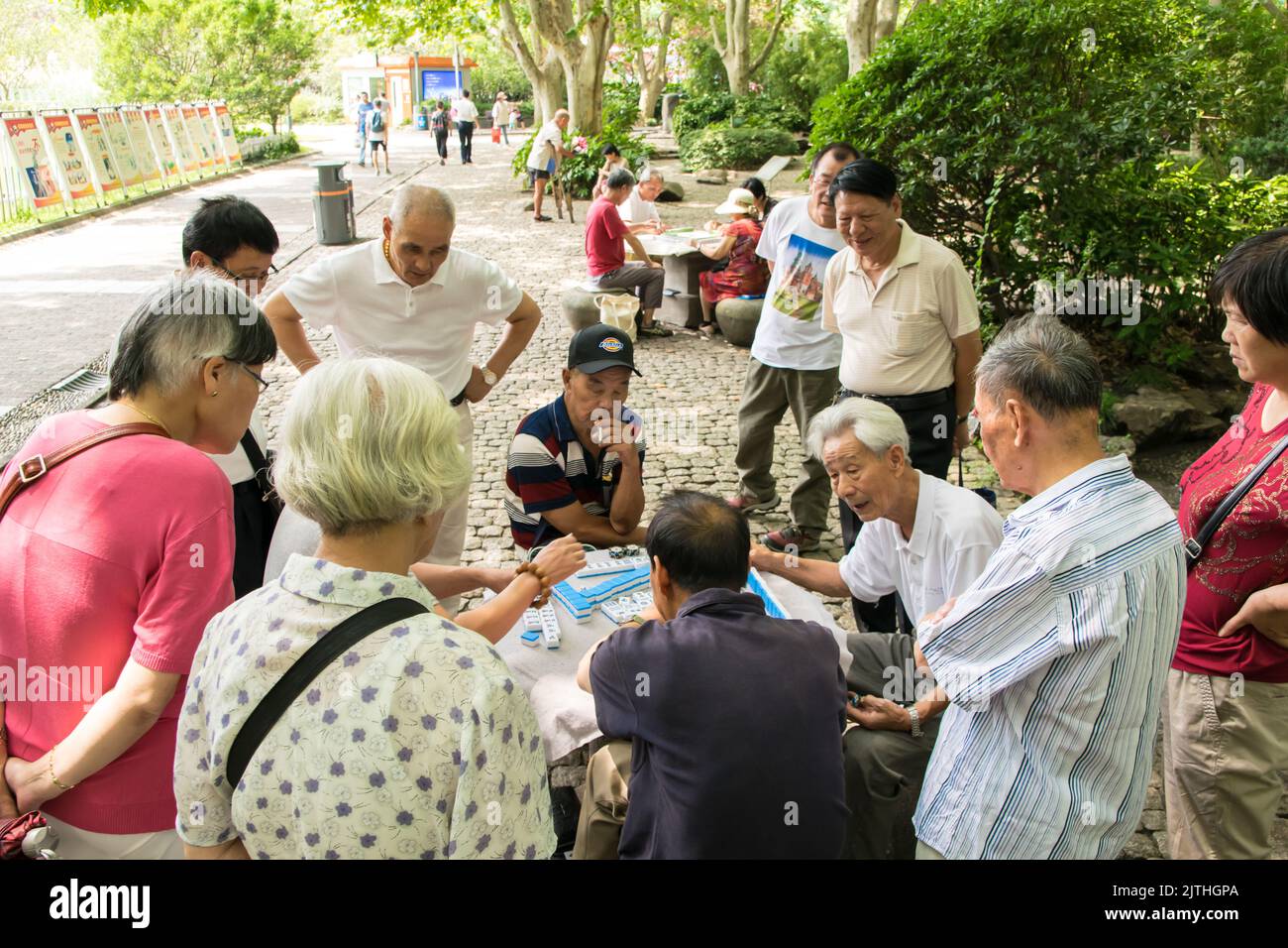 Chinese people play Mahjong in People's Square public park while other ...
