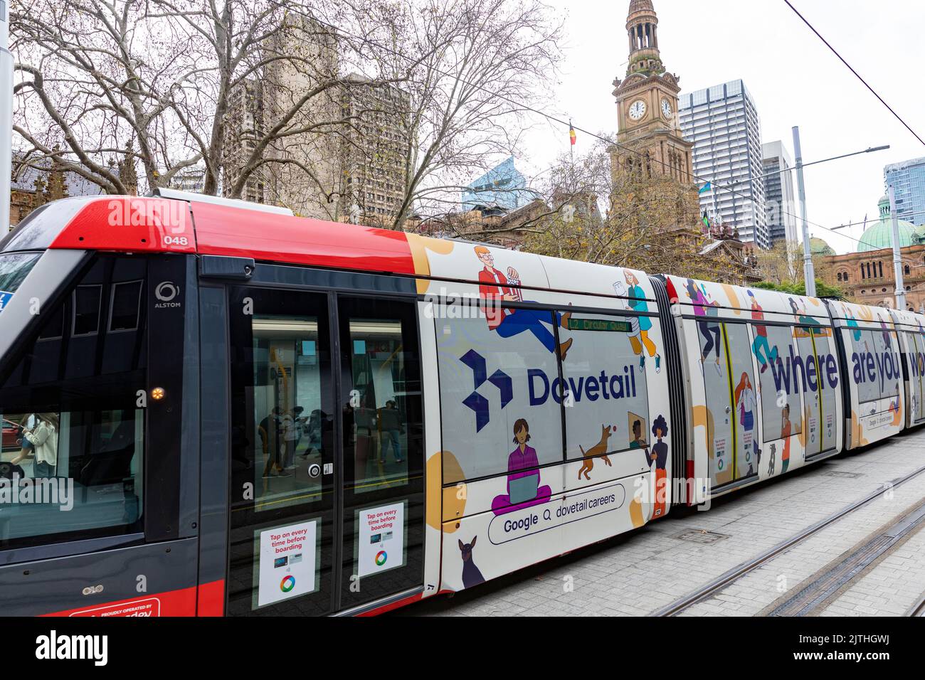 Sydney CBD light rail train at Town Hall station, carriage advertising ...