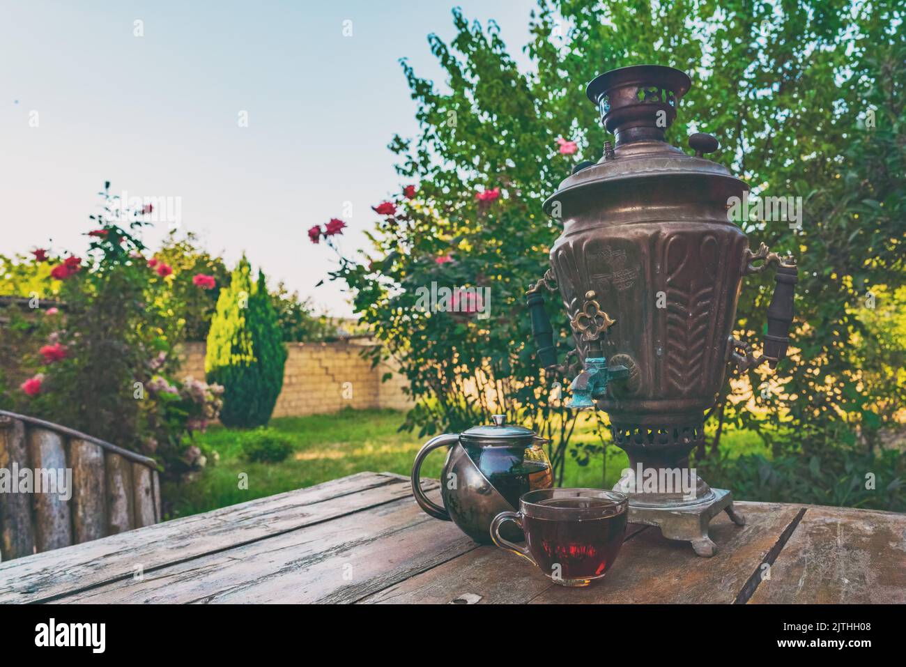 Tea drinking from a vintage samovar in garden Stock Photo - Alamy