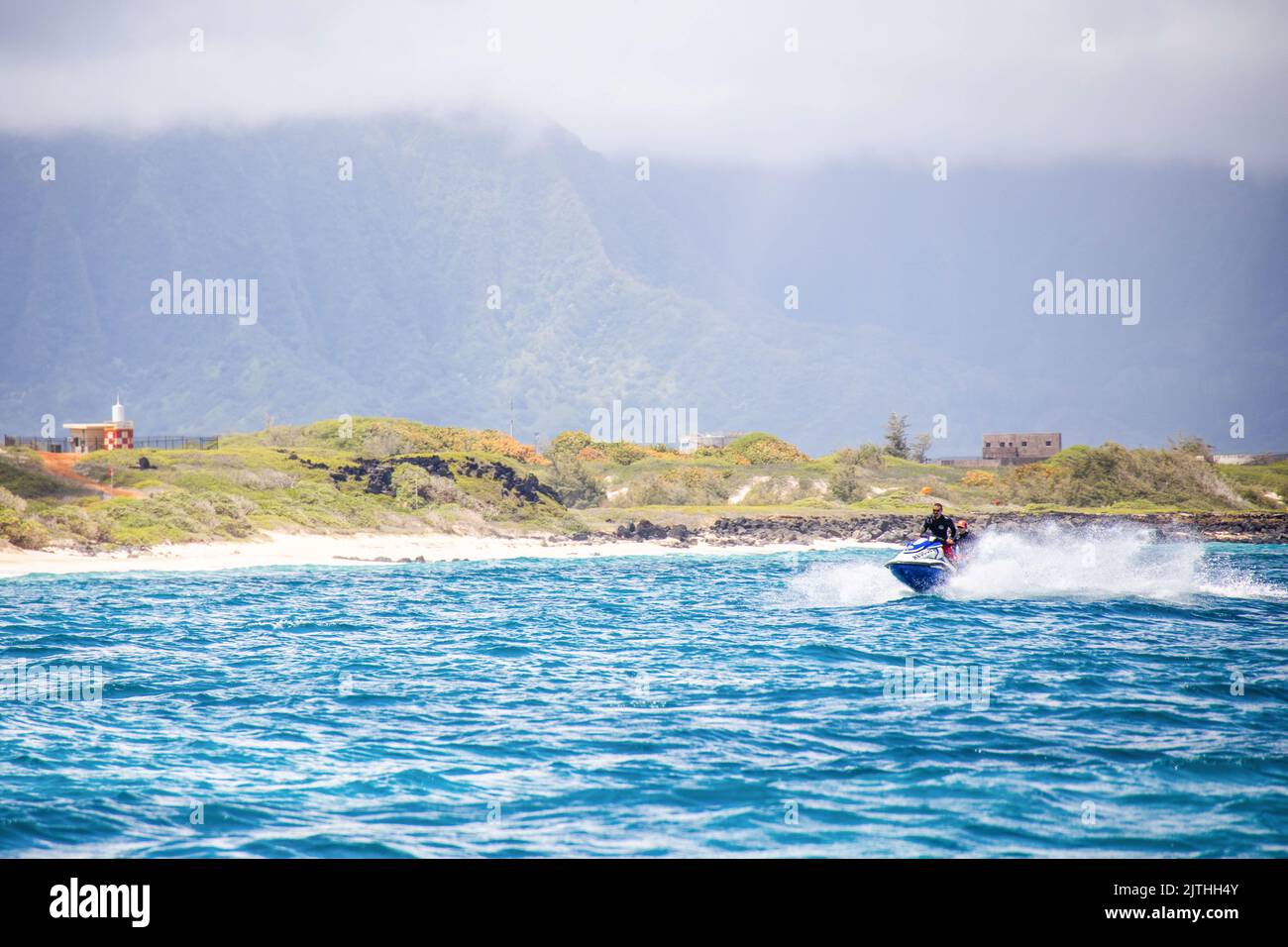 Marine Corps Community Services lifeguards aboard a jet ski move to a ...